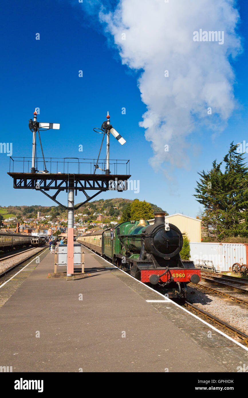 Ex-GWR steam loco 6960 'Raveningham Hall' departing from Minehead ...