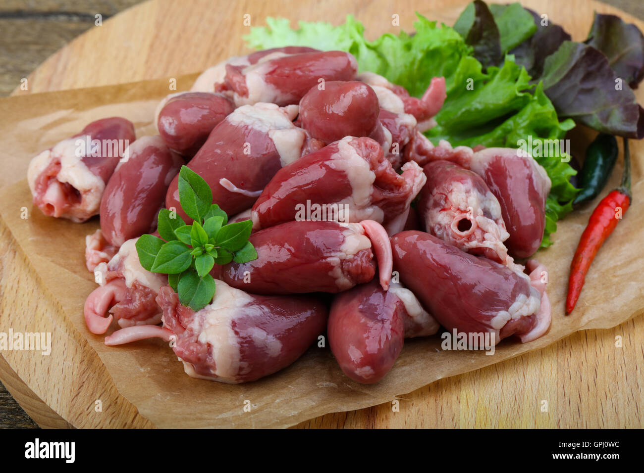 Raw chicken hearts on the plate ready for cooking Stock Photo - Alamy
