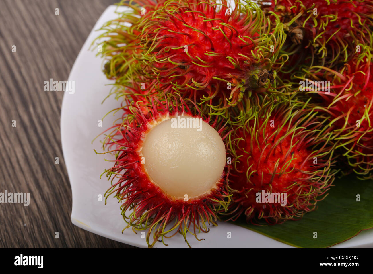 Fresh ripe sweet Rambutan heap - asian fruit Stock Photo - Alamy