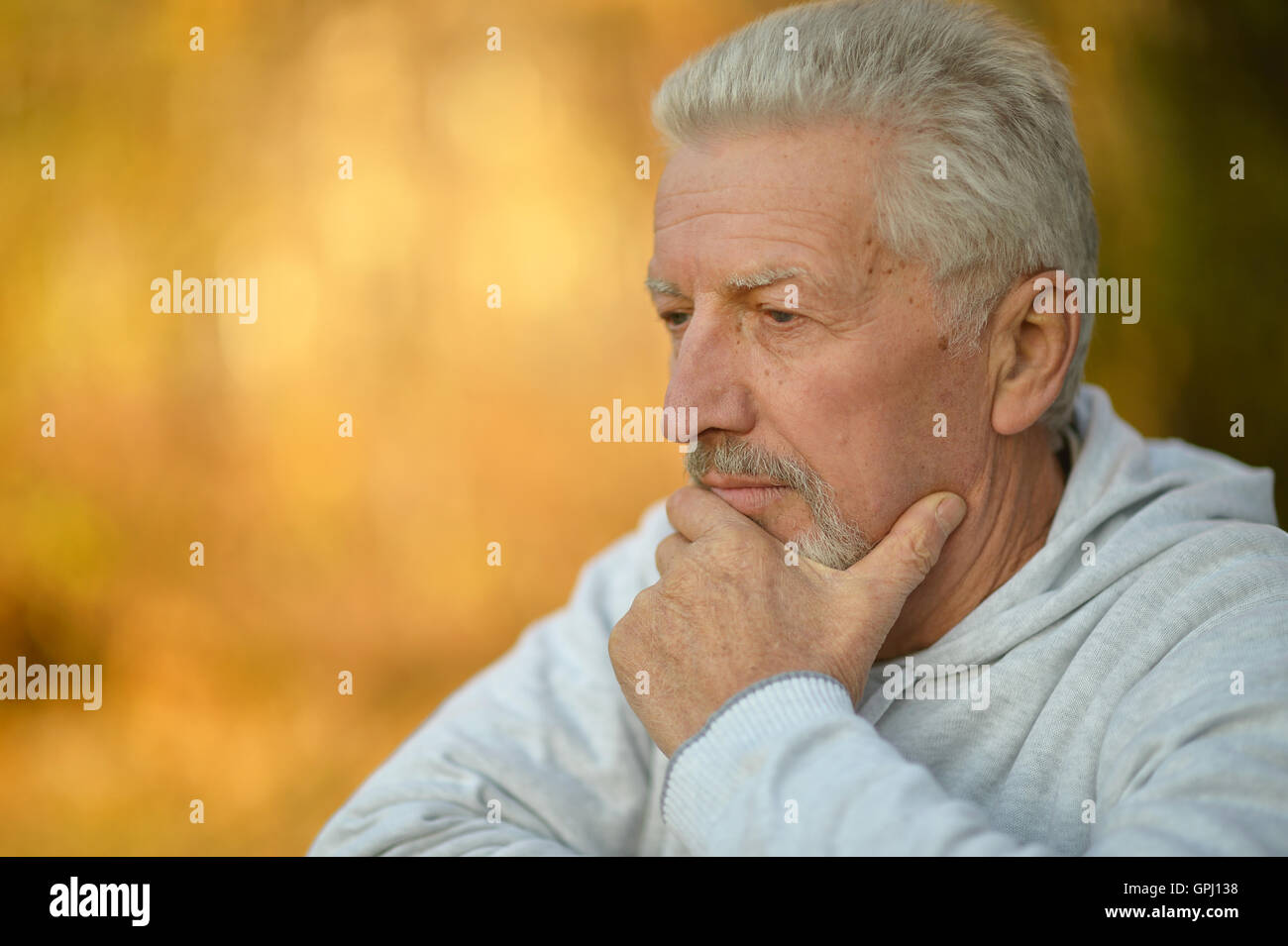 Senior man thinking Stock Photo - Alamy