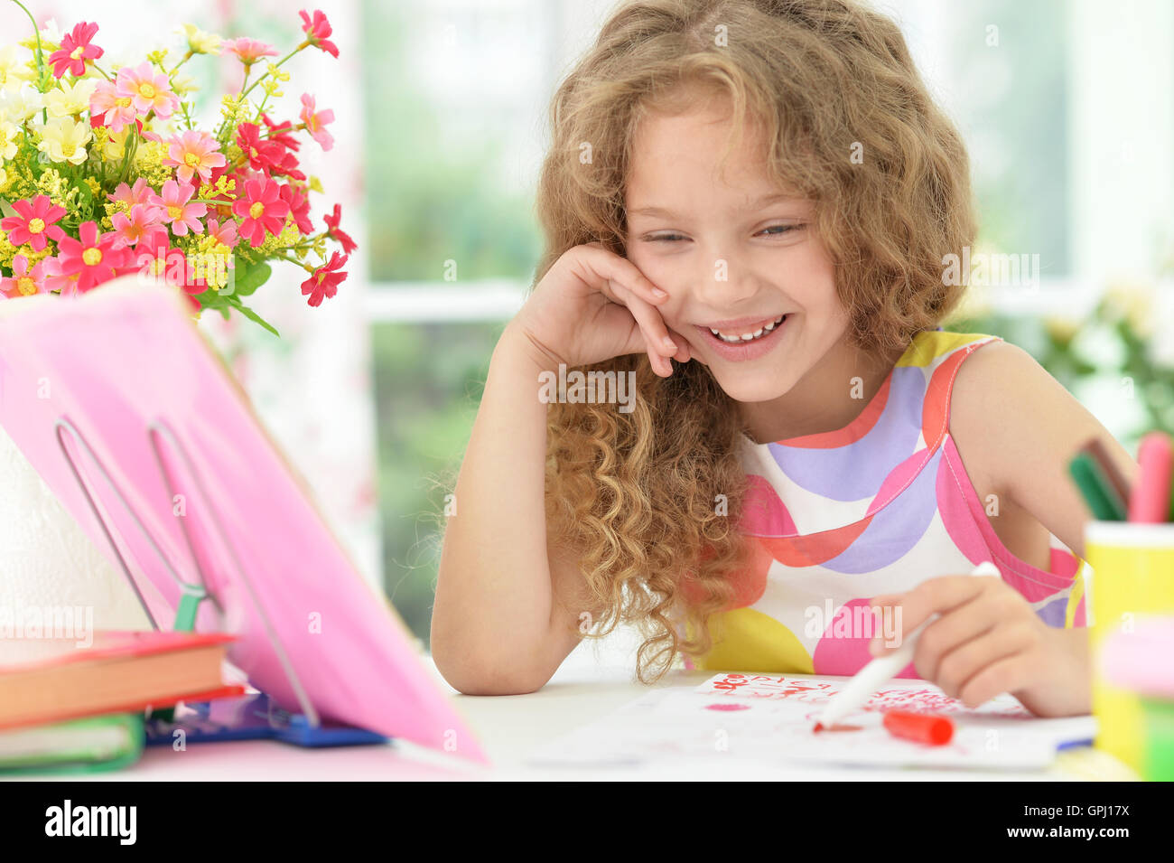 Little girl drawing at class Stock Photo - Alamy