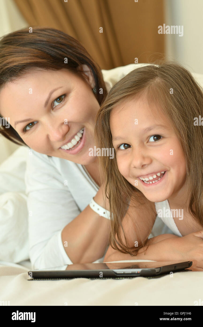 mother and daughter with tablet pc Stock Photo - Alamy