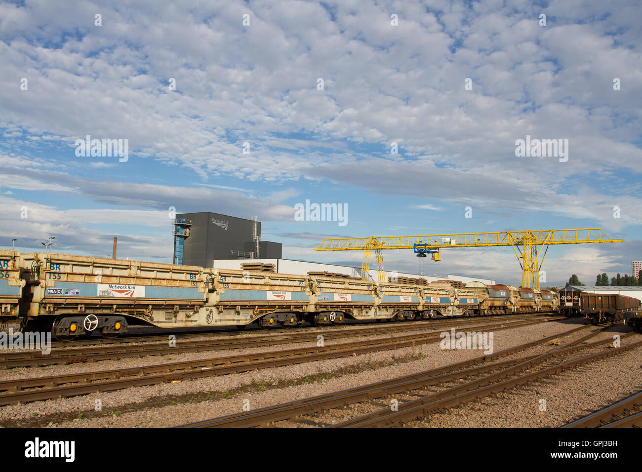 A Network rail Infrastructure depot with freight trains ready to depart ...