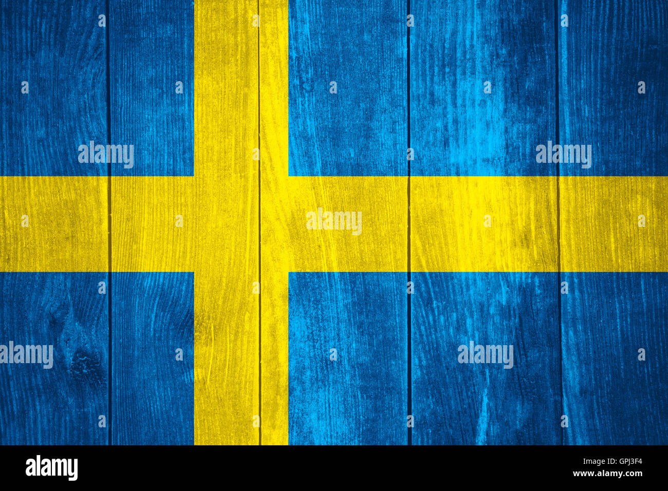 flag of Sweden or Swedish banner on wooden background Stock Photo - Alamy