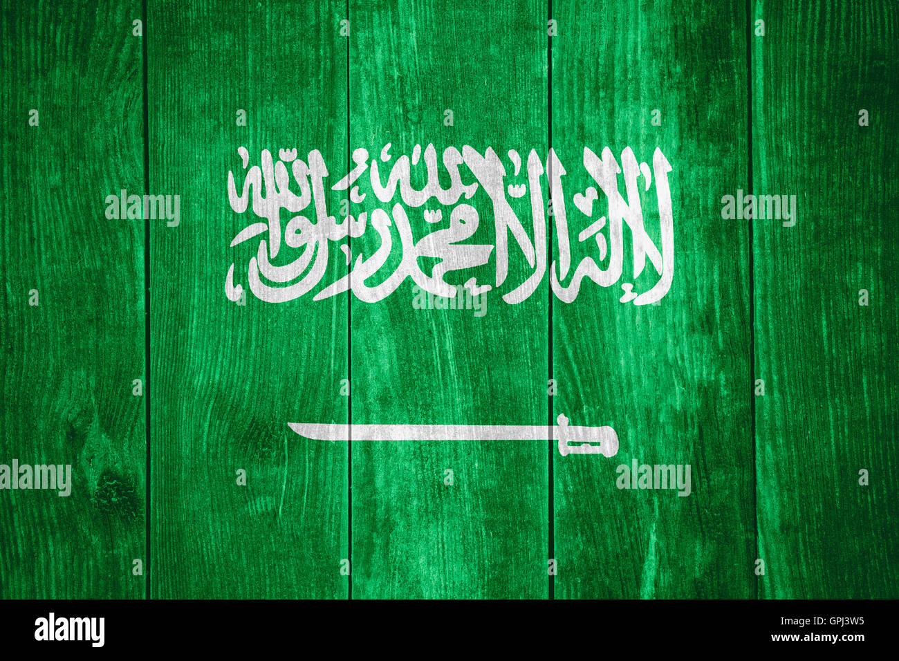 flag of Saudi Arabia or Saudi Arabian banner on wooden background Stock ...