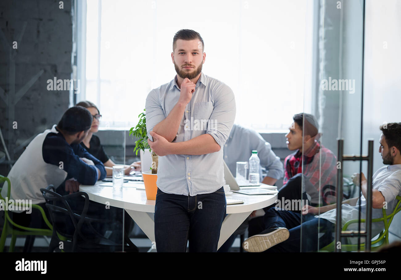 Businessman in office interior Stock Photo - Alamy