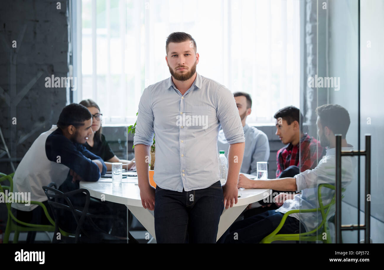 Businessman in office interior Stock Photo - Alamy
