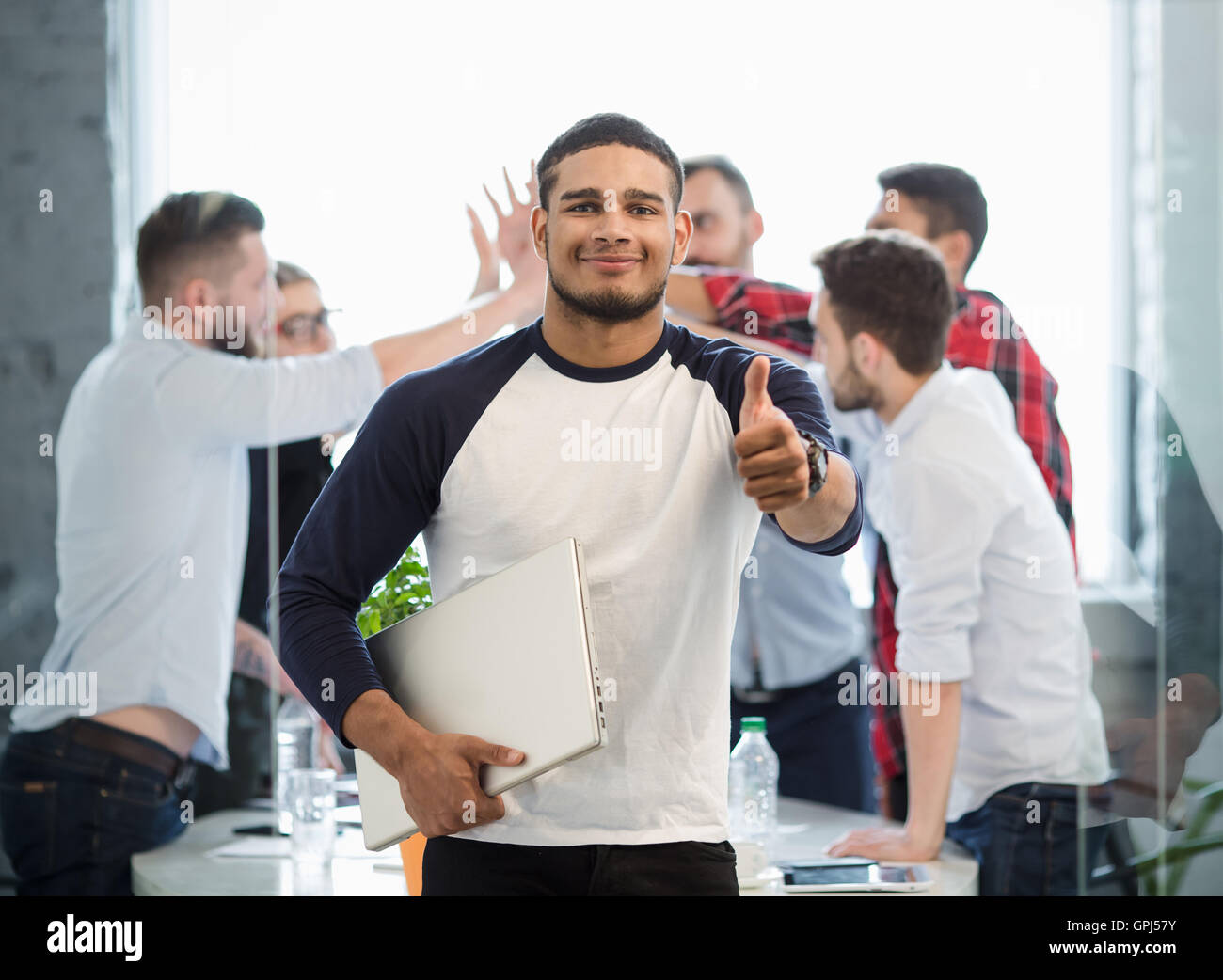 Businessman in office interior Stock Photo - Alamy