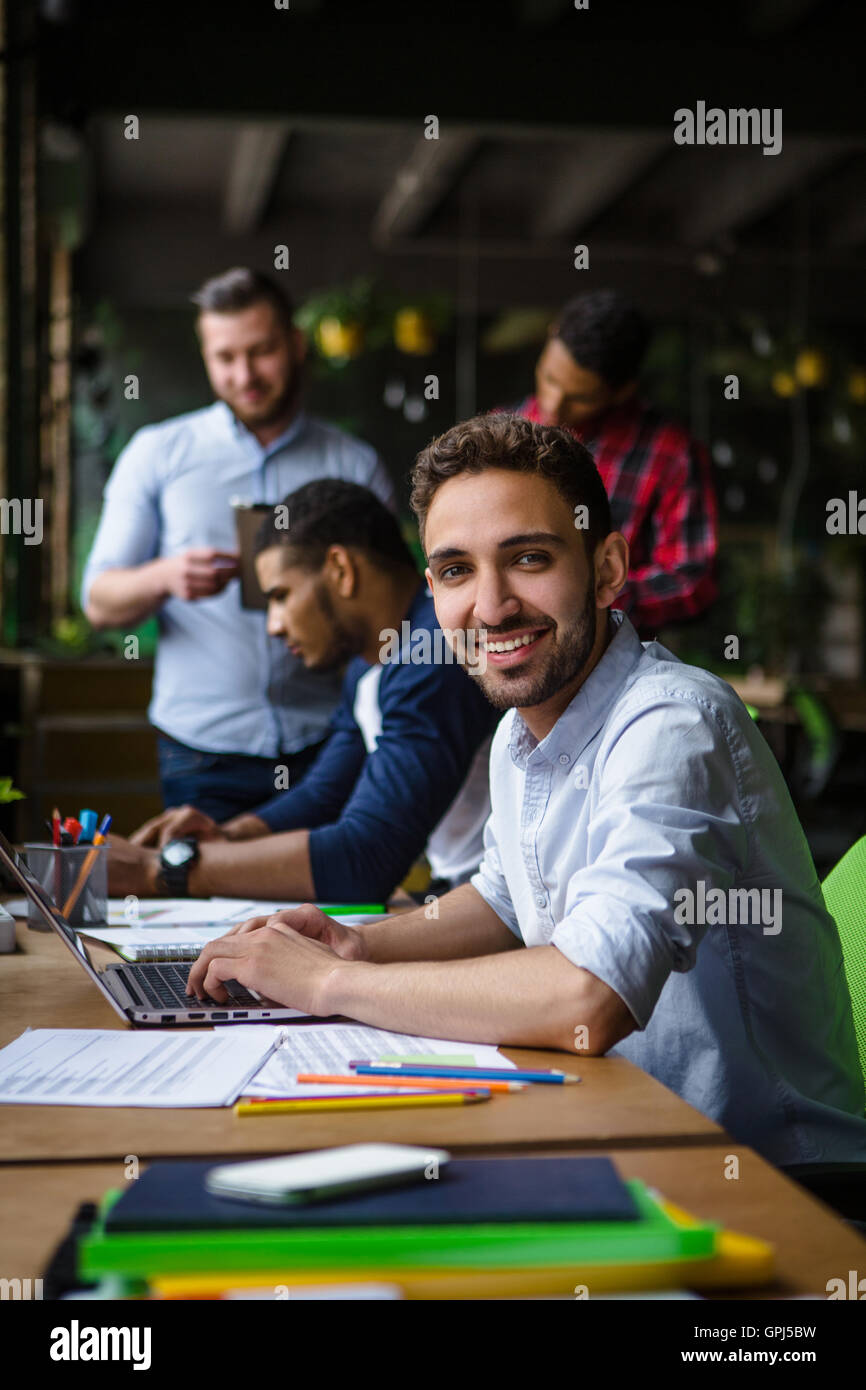 Businessman typing on laptop at office desk hi-res stock photography ...