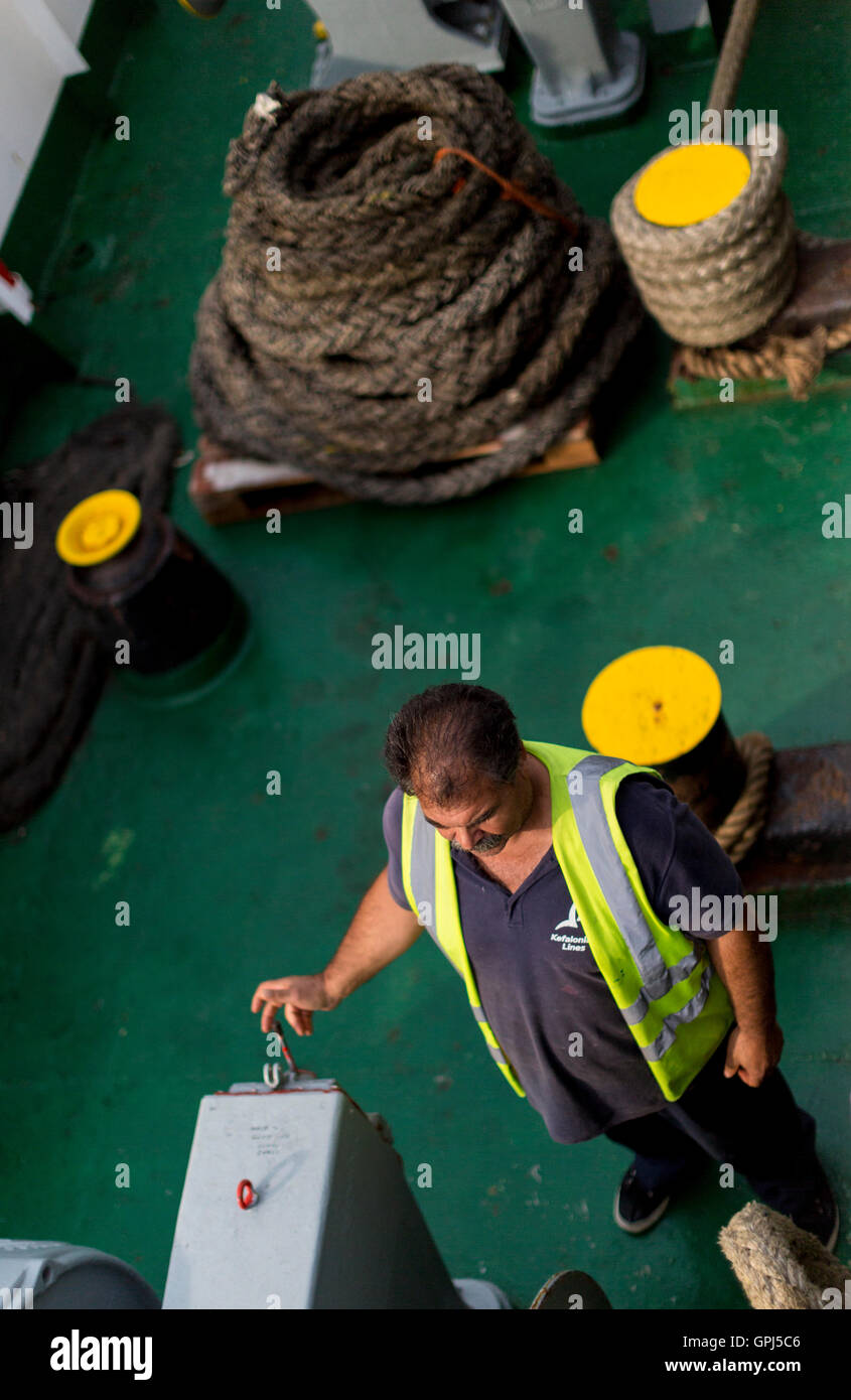Greek ferry crew before docking at port. Guiding boat during docking ...