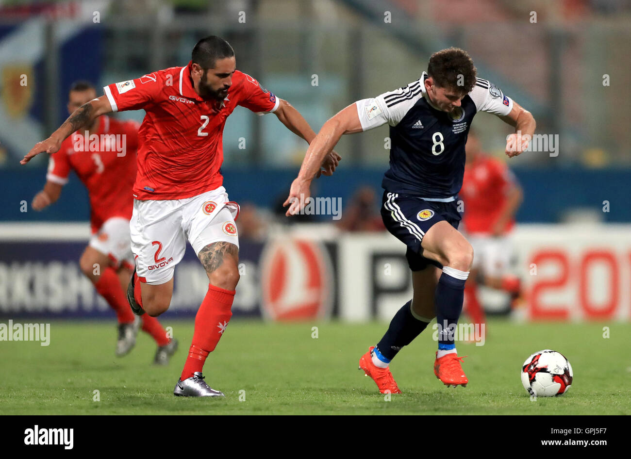 Malta's Jonathan Caruana (left) and Scotland's Oliver Burke (right ...