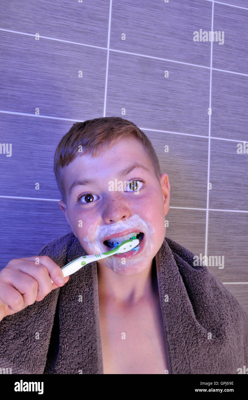 Young boy brushing teeth Stock Photo - Alamy