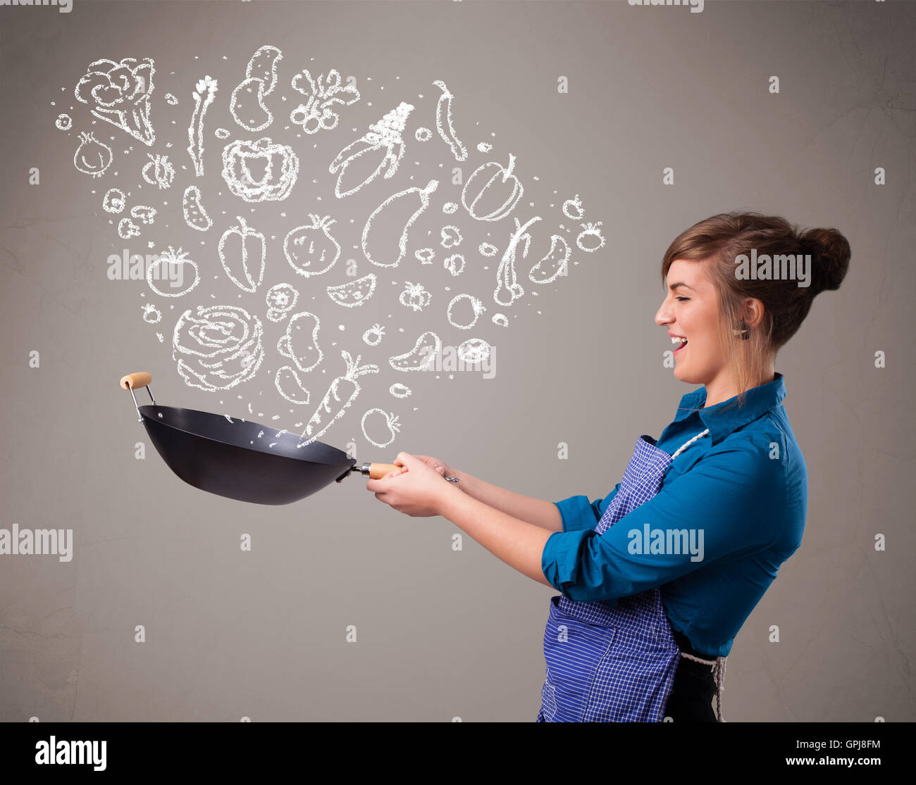 Woman cooking vegetables Stock Photo - Alamy