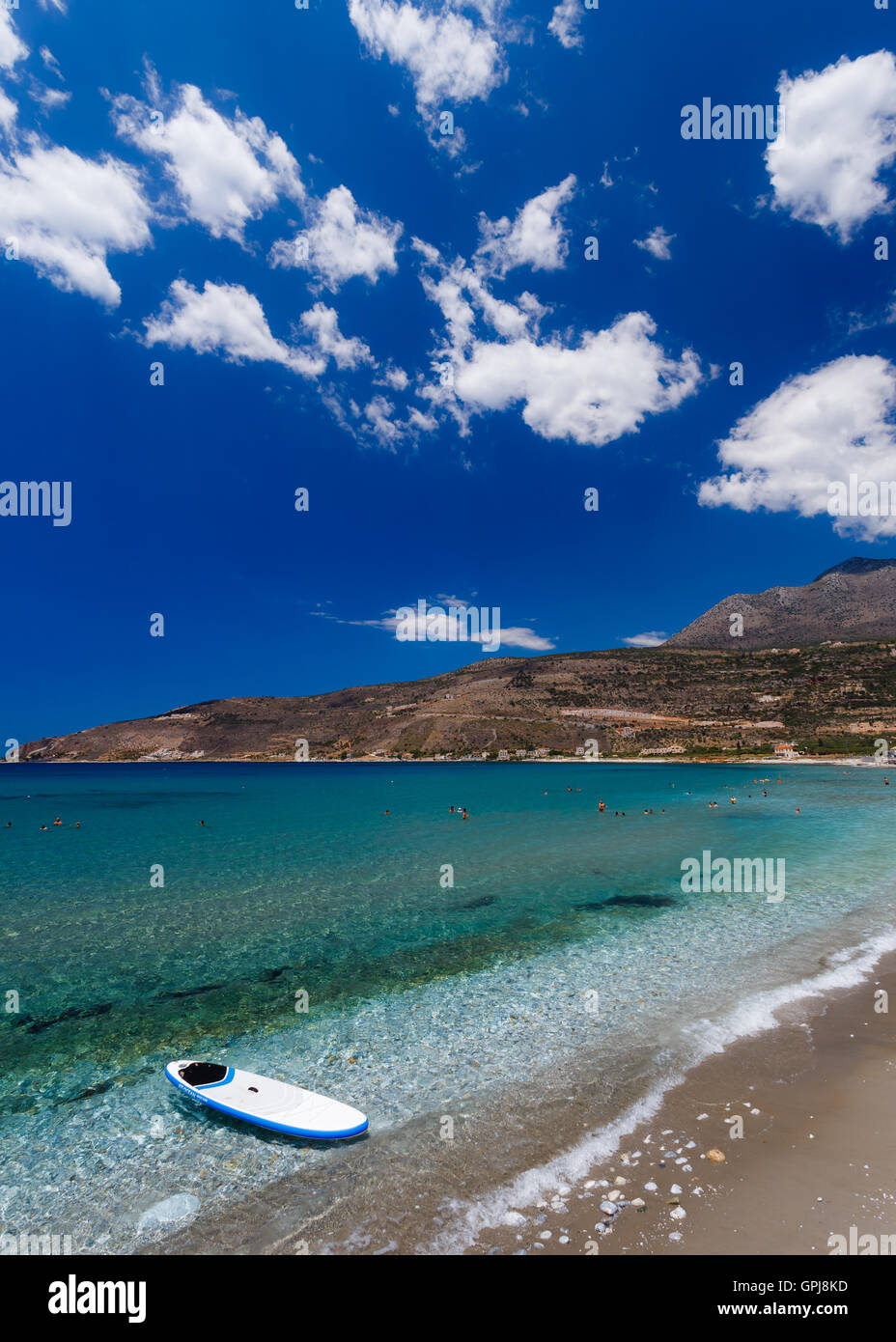 Sun bathers enjoying the beach and playing water games at Neo Itilo ...