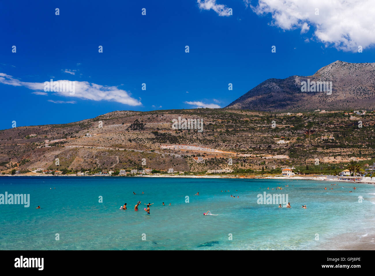 Sun bathers enjoying the beach and playing water games at Neo Itilo ...