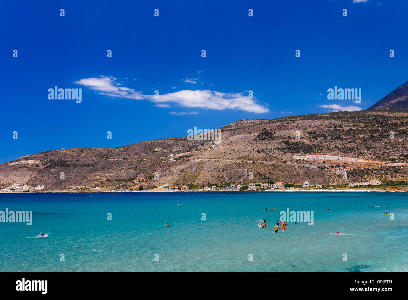 Sun bathers enjoying the beach and playing water games at Neo Itilo ...