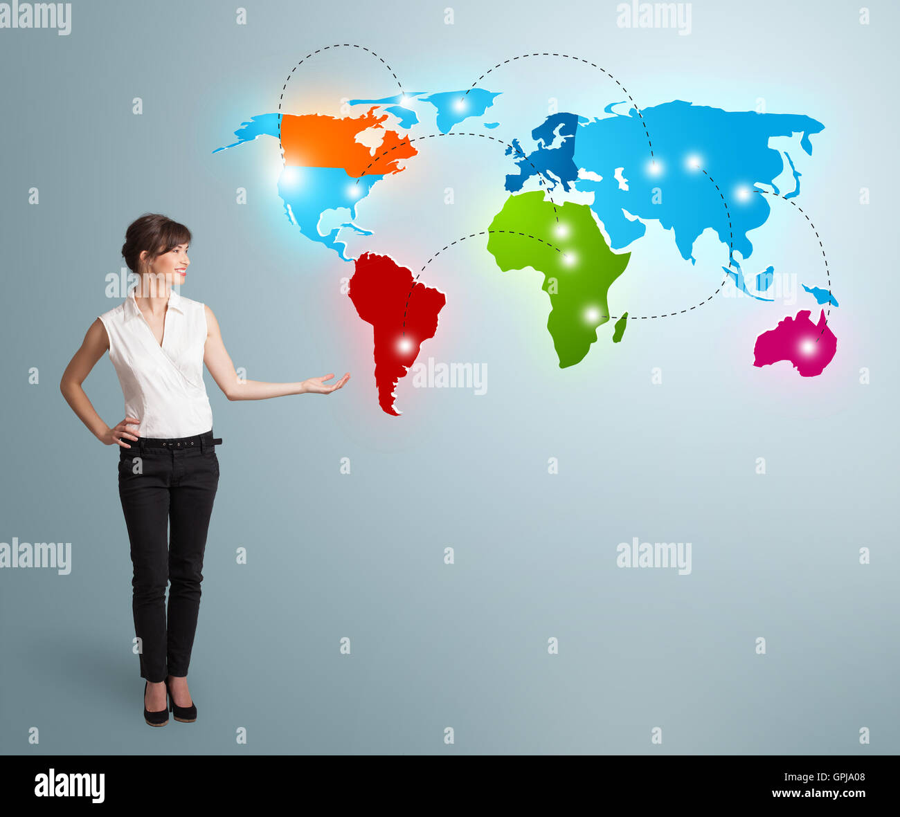 Young woman presenting colorful world map Stock Photo - Alamy