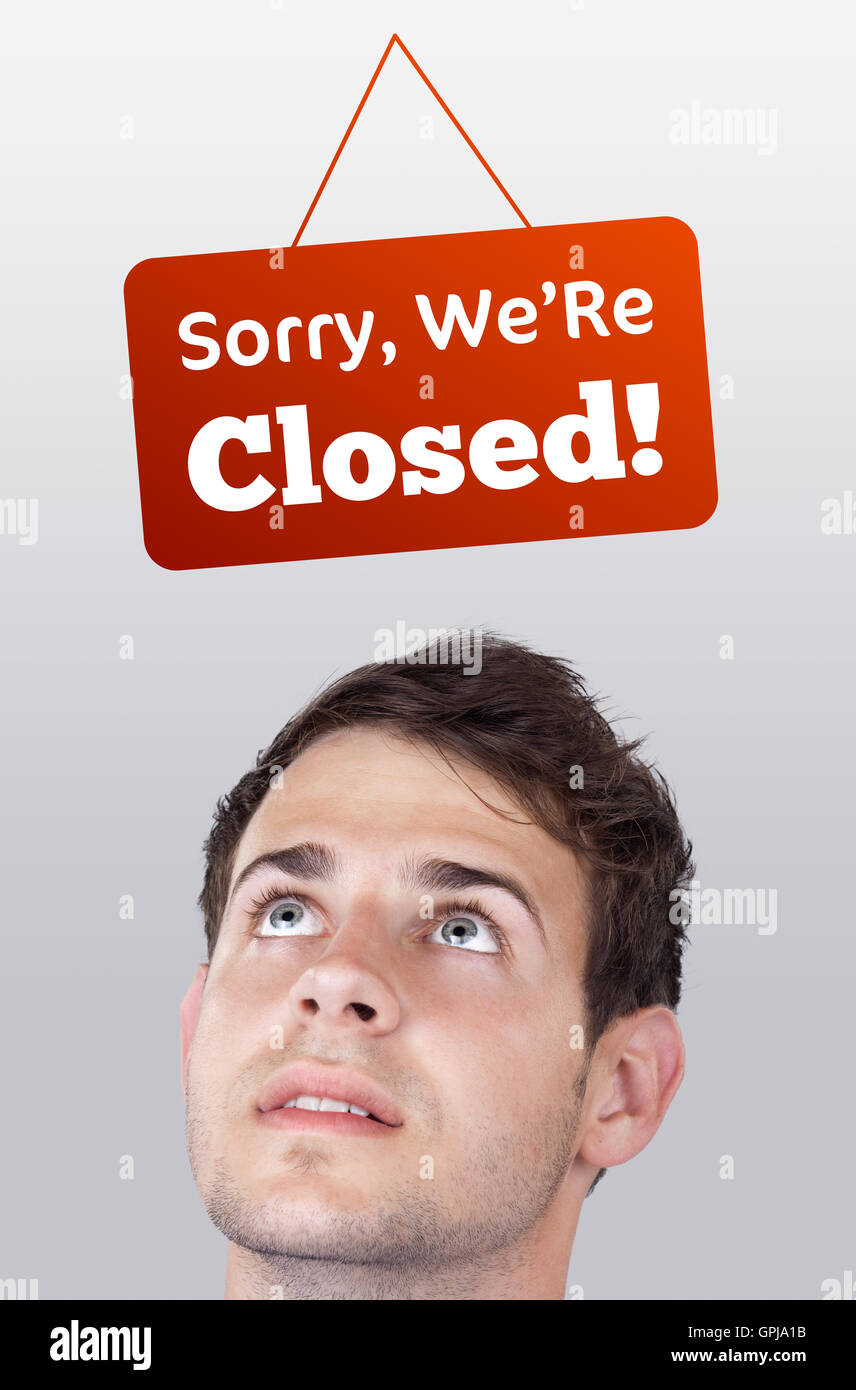 Young persons head looking at closed and open signs Stock Photo - Alamy