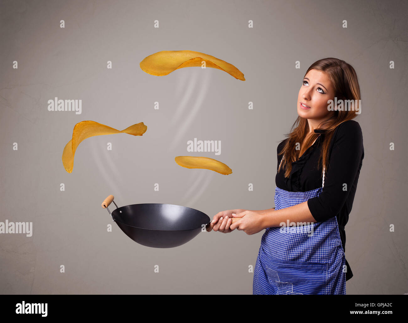 Woman making pancakes Stock Photo - Alamy