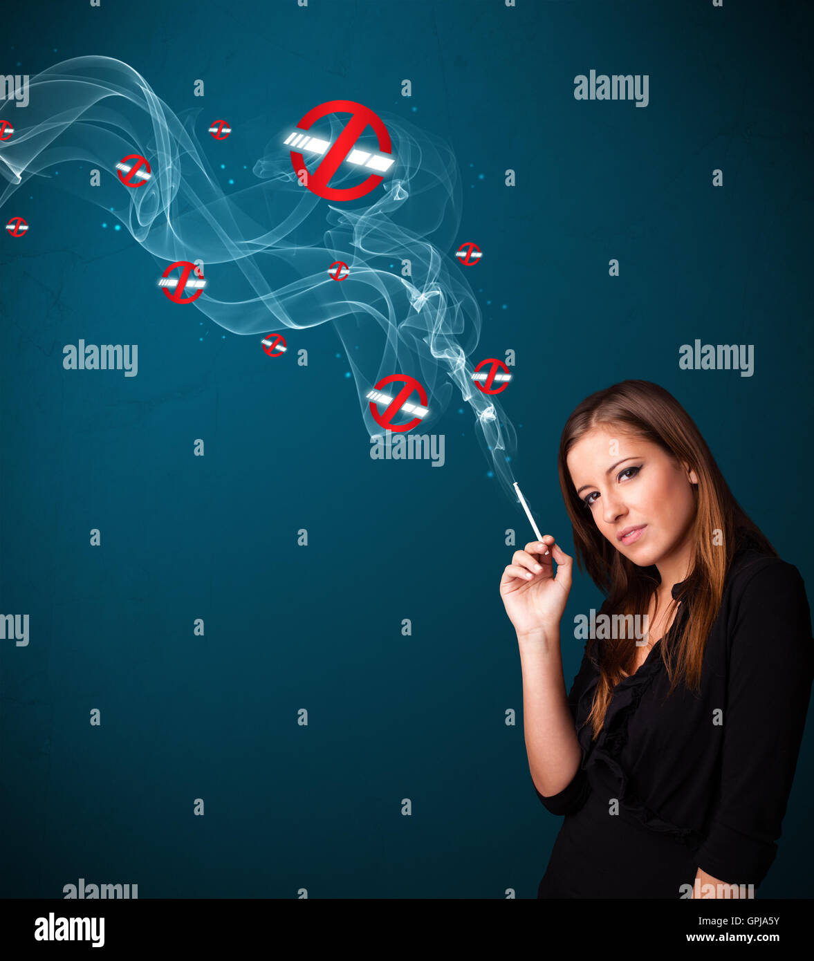 Young woman smoking dangerous cigarette with no smoking signs Stock ...
