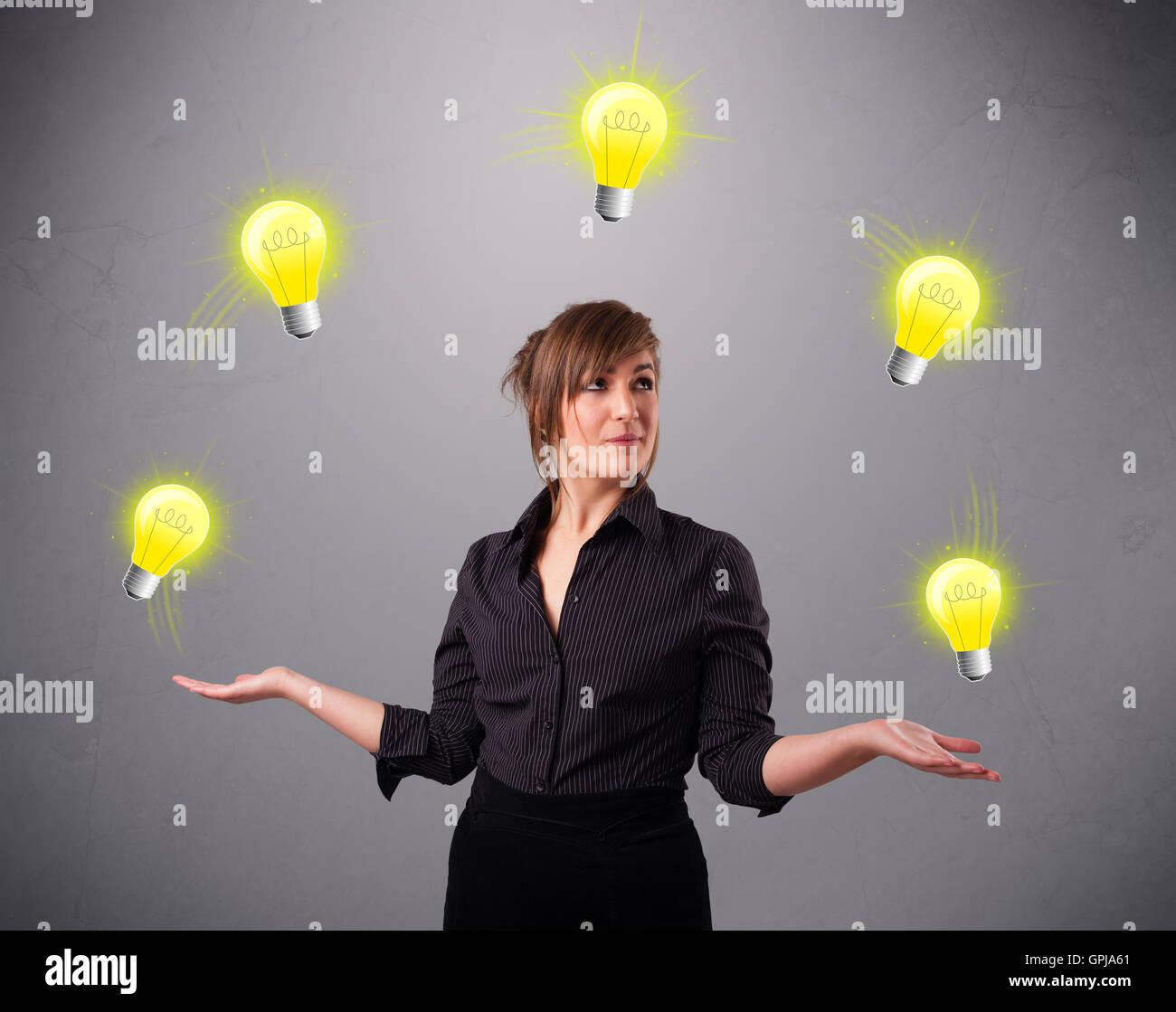 young lady standing and juggling with light bulbs Stock Photo - Alamy