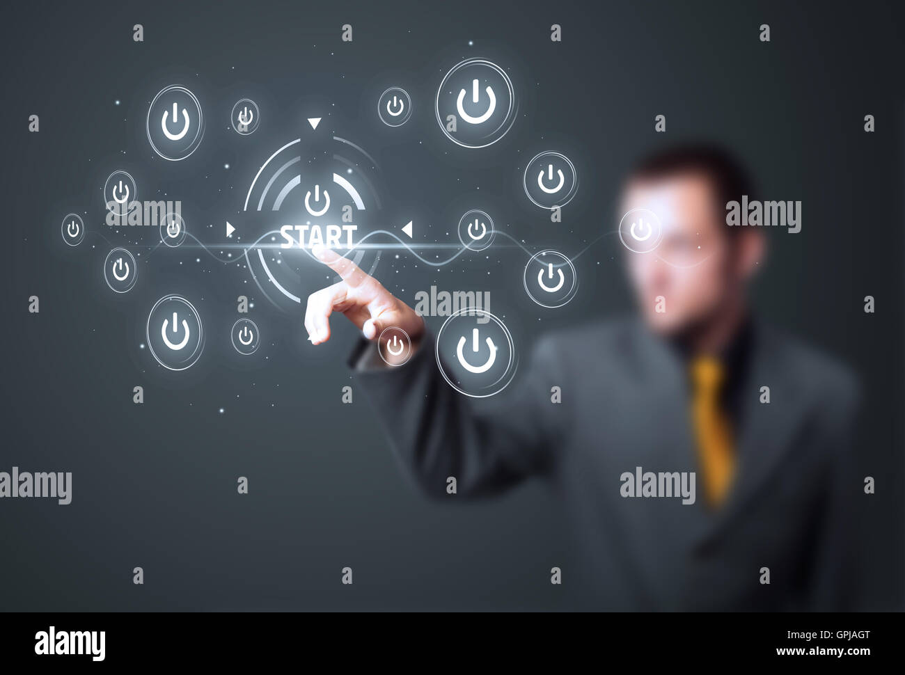 Businessman pressing simple type of start buttons Stock Photo - Alamy