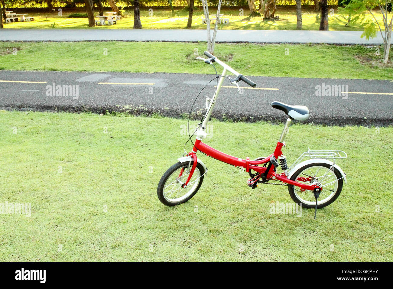 small red bicycle and road Stock Photo - Alamy