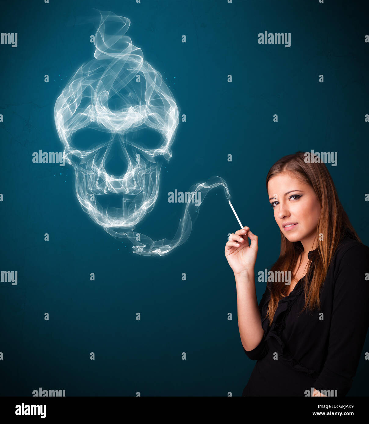 Young woman smoking dangerous cigarette with toxic skull smoke Stock ...