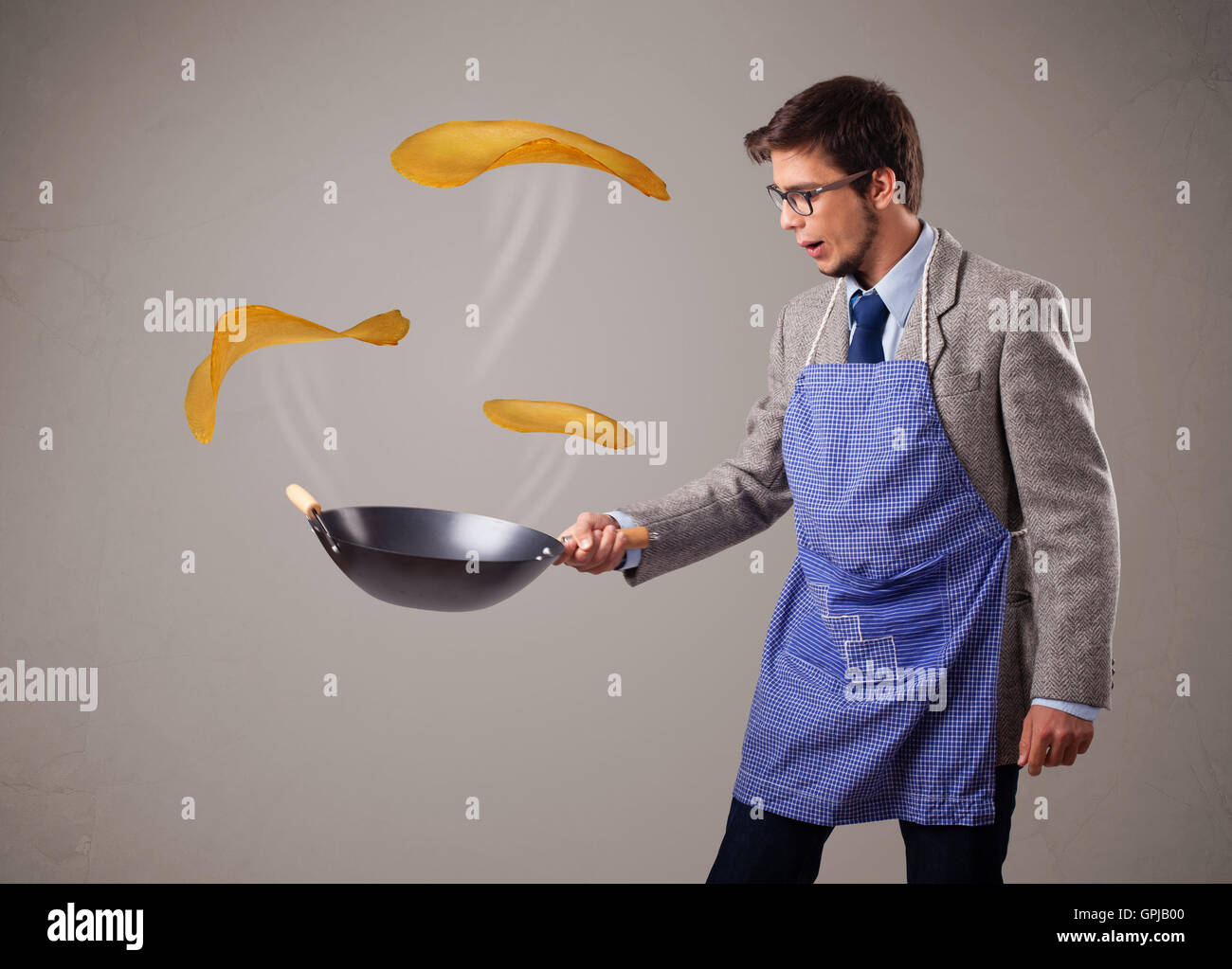 Boy making pancakes Stock Photo - Alamy