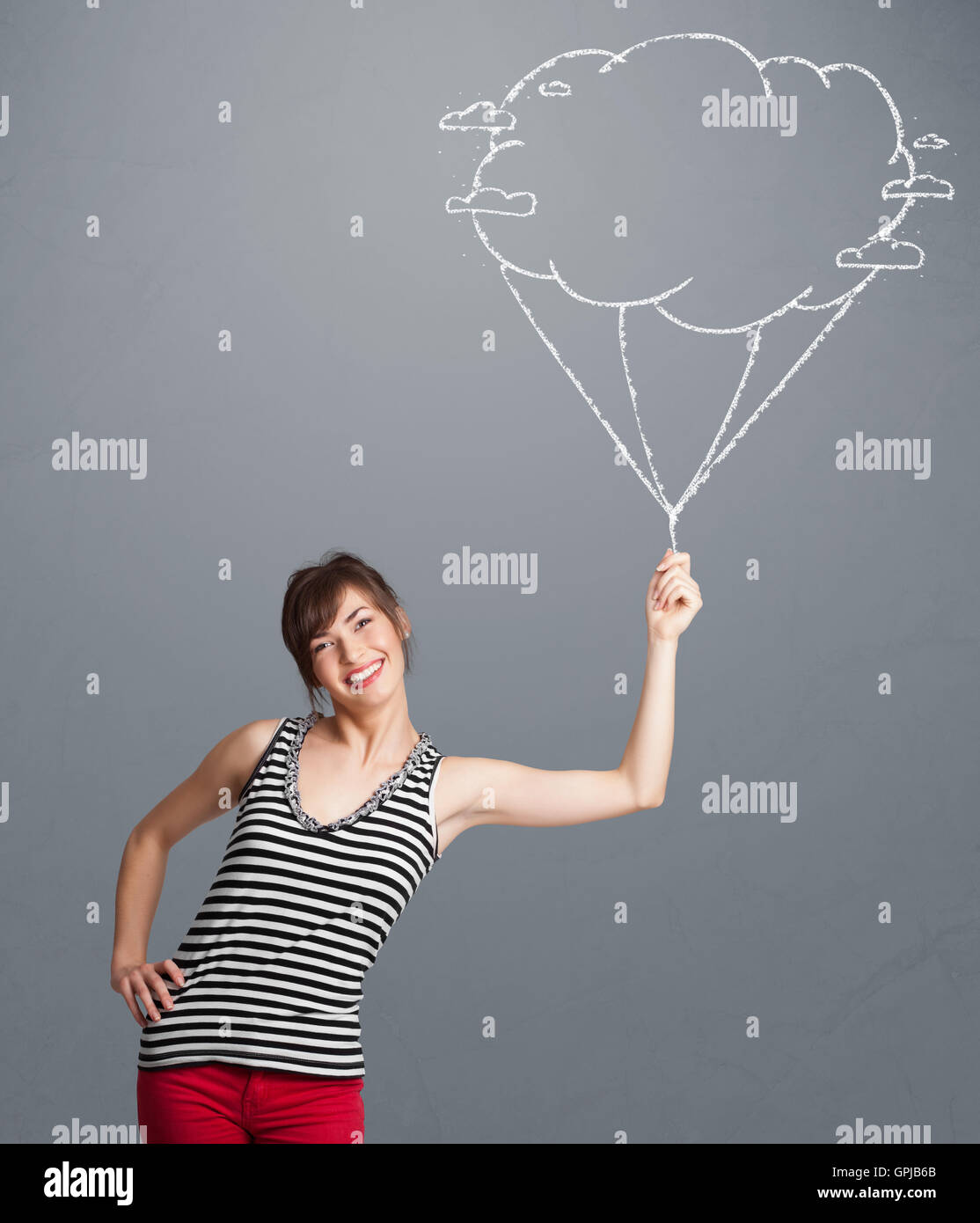 Pretty lady holding a cloud balloon drawing Stock Photo - Alamy