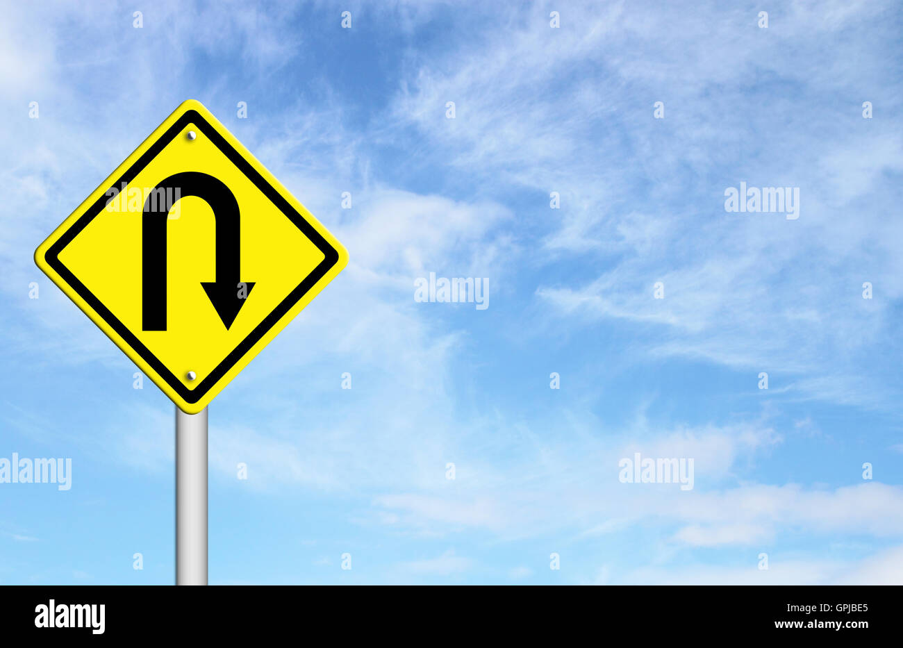 Yellow warning sign u-turn roadsign Stock Photo - Alamy
