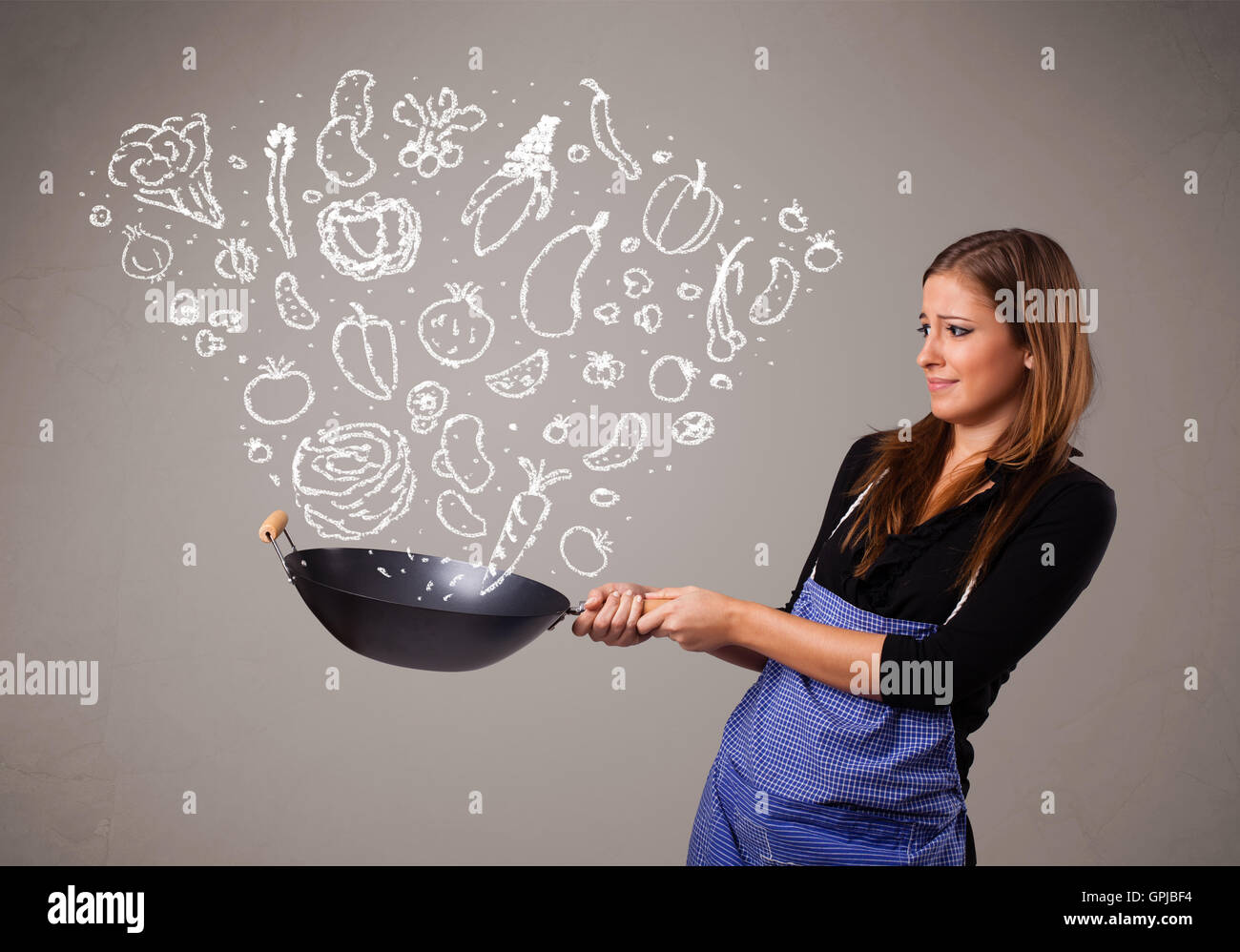 Woman cooking vegetables Stock Photo - Alamy