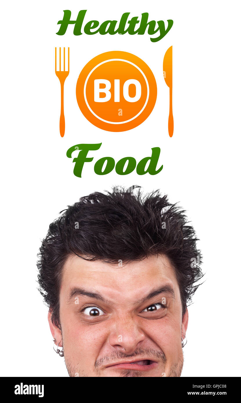 Young head looking at healthy food sign Stock Photo - Alamy