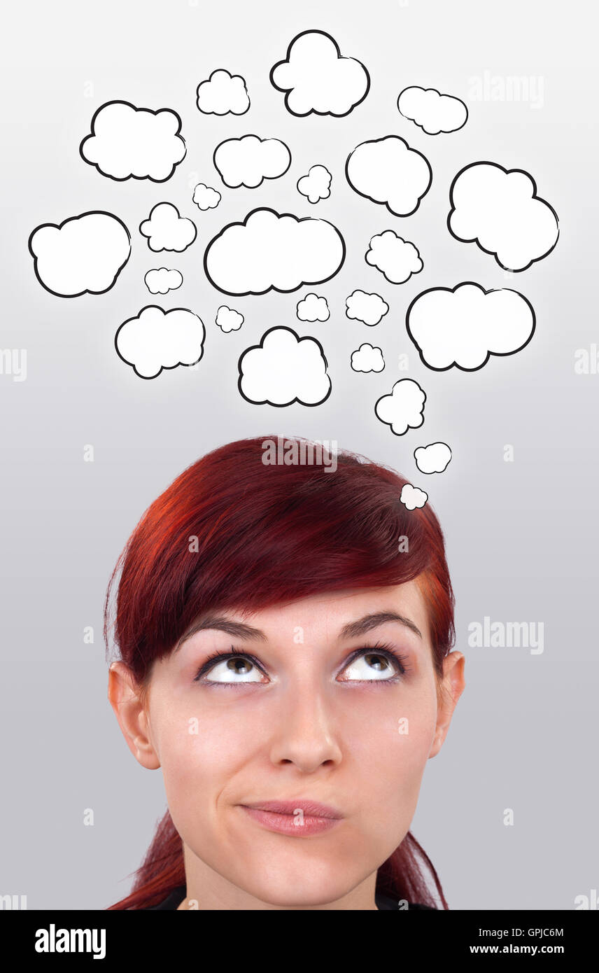 Young girl thinking with clouds Stock Photo - Alamy