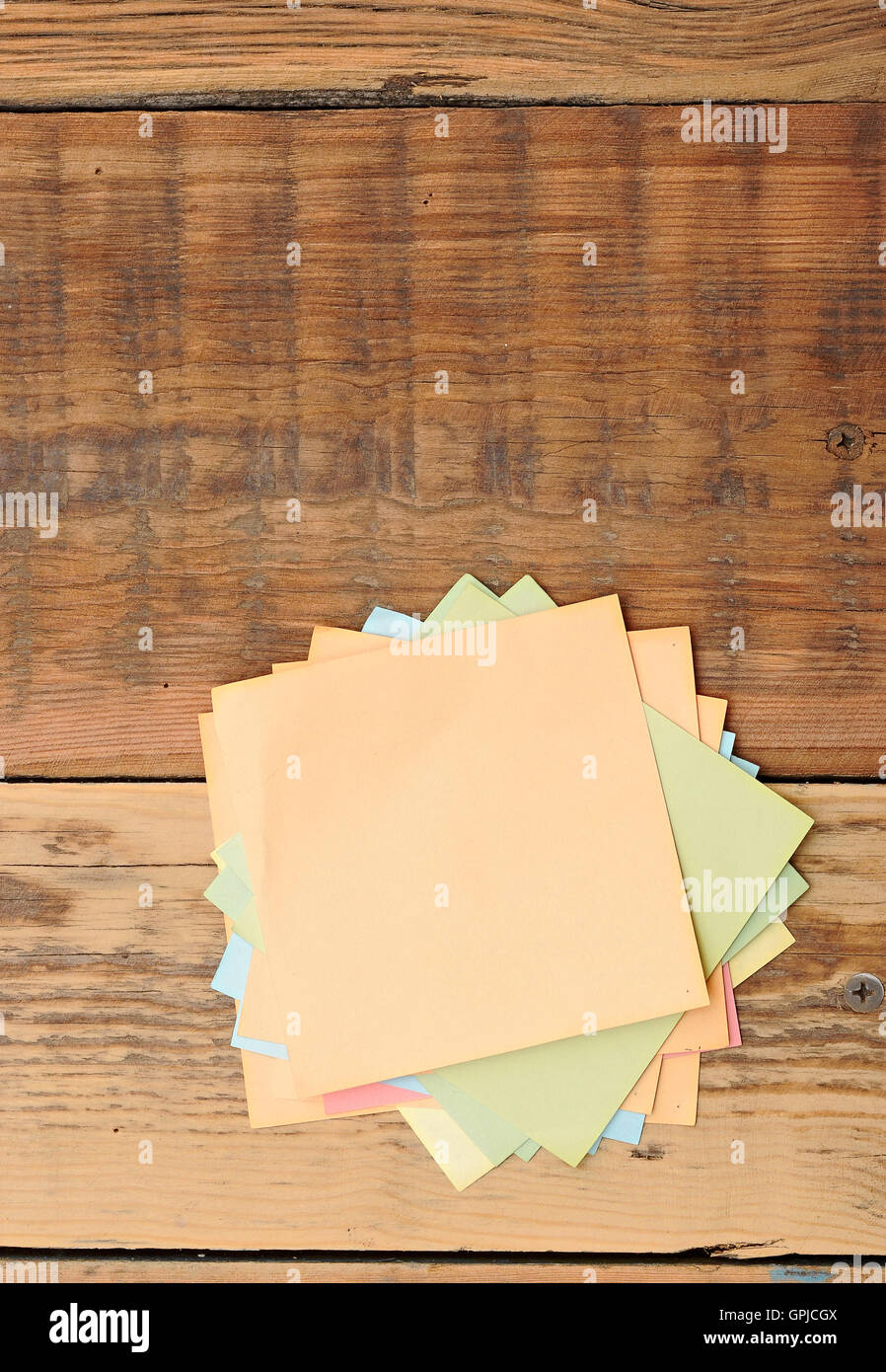 collection of various note papers on wooden background Stock Photo - Alamy