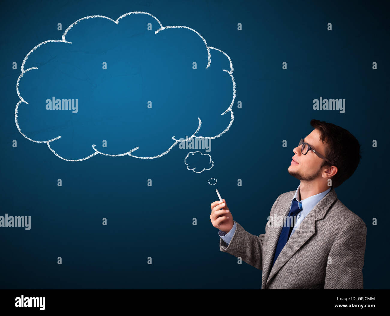 Young man smoking cigarette with idea cloud Stock Photo - Alamy