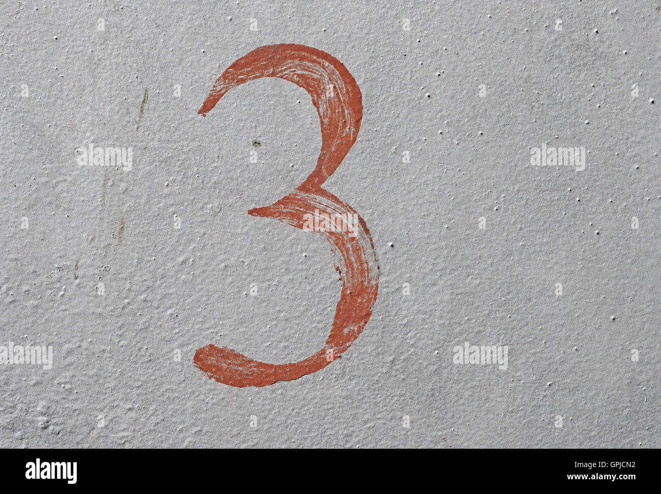 3 - old brown handwritten number over grunge silver background Stock ...