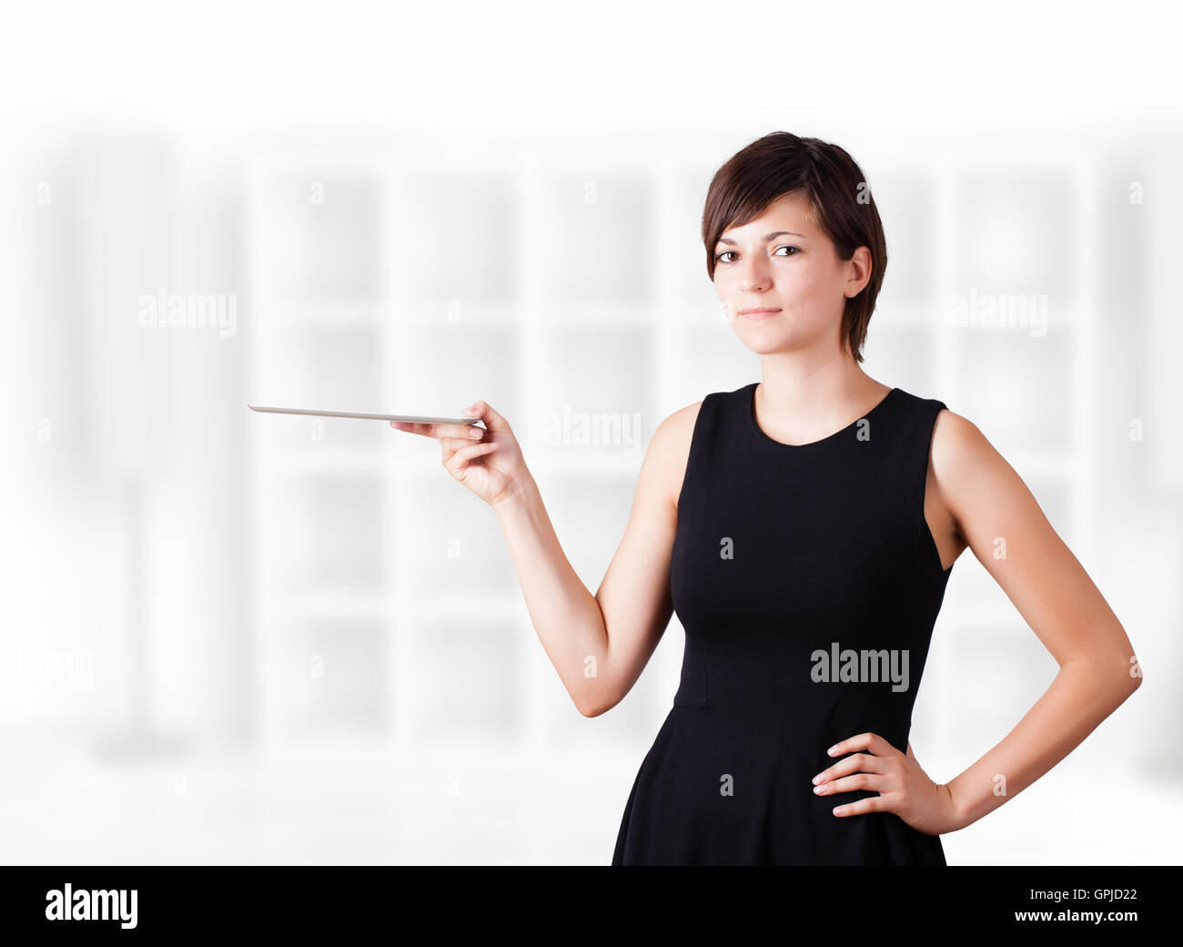 Young woman looking at modern tablet Stock Photo - Alamy