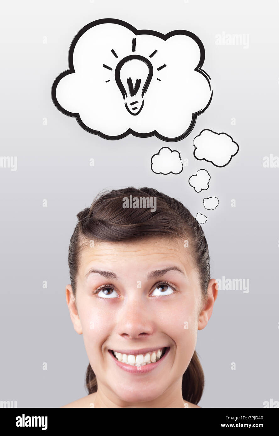 Young girl thinking with clouds Stock Photo - Alamy