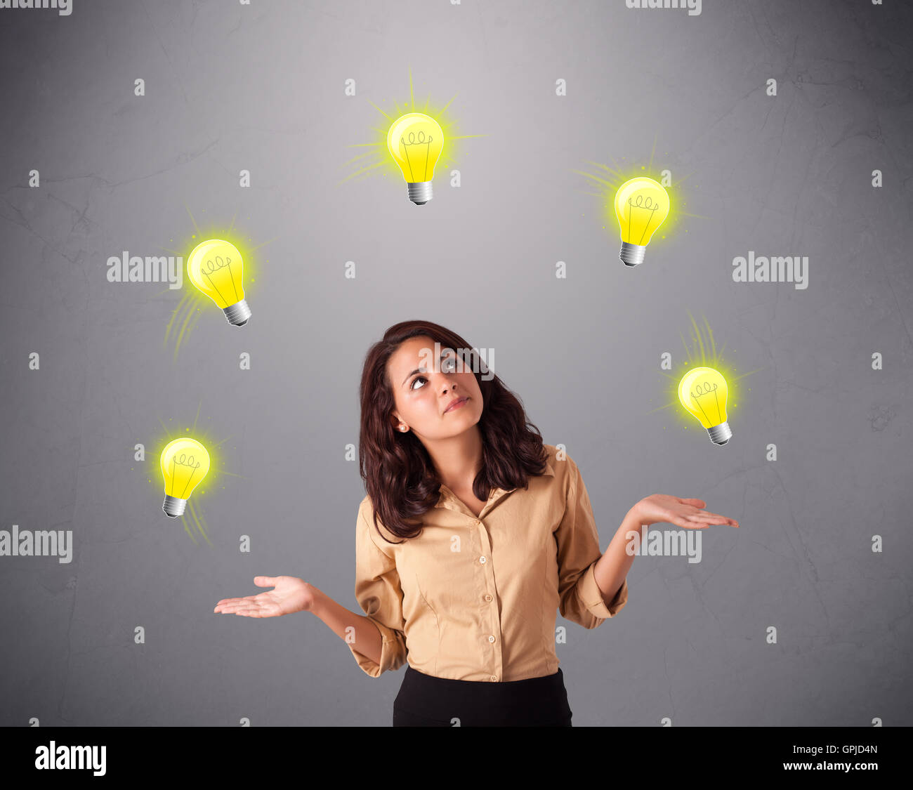 young lady standing and juggling with light bulbs Stock Photo - Alamy
