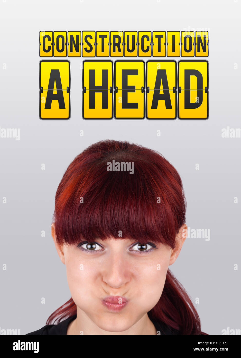 Young girl looking at idea type of sign Stock Photo - Alamy
