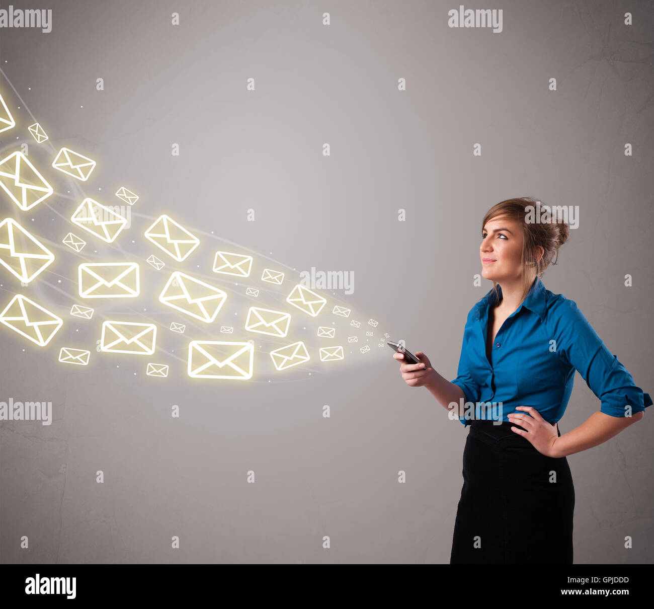 attractive young lady holding a phone with message icons Stock Photo ...