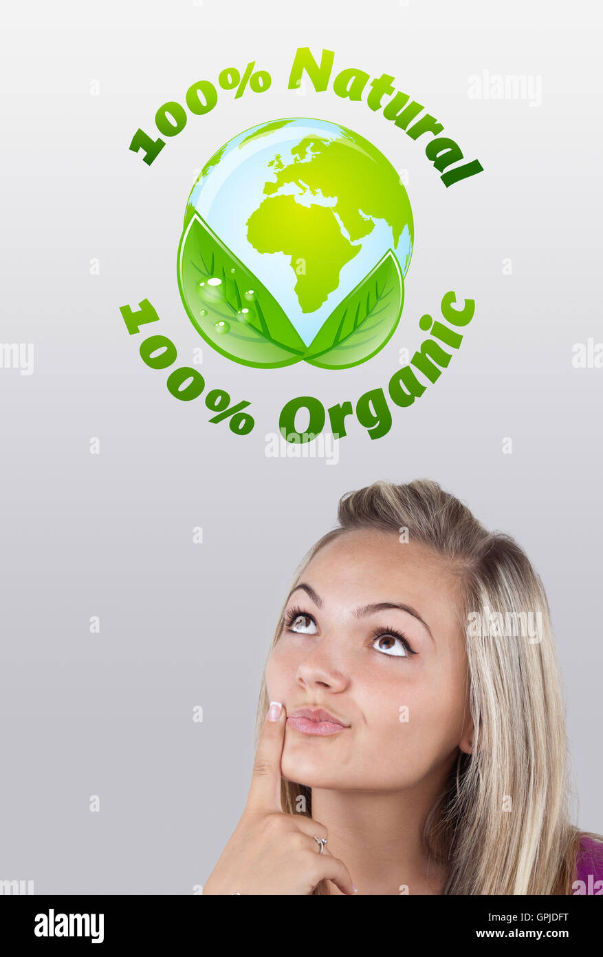 Young girl looking at green eco sign Stock Photo - Alamy
