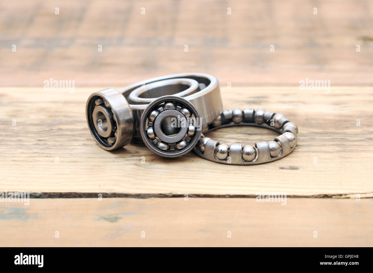 steel ball bearings on wooden table Stock Photo - Alamy