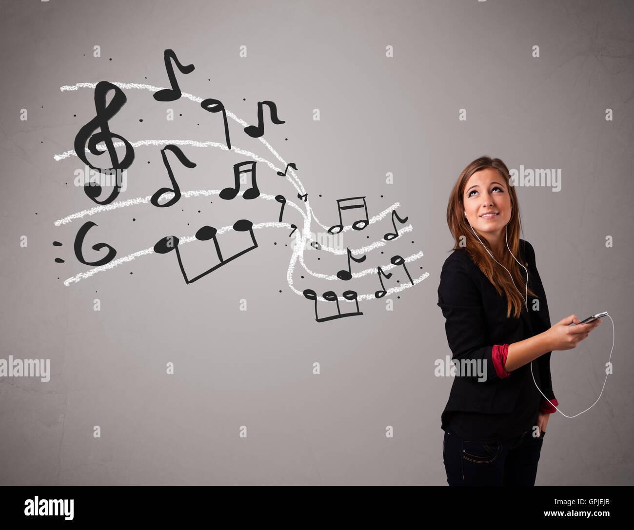 attractive young lady singing and listening to music with musica Stock ...