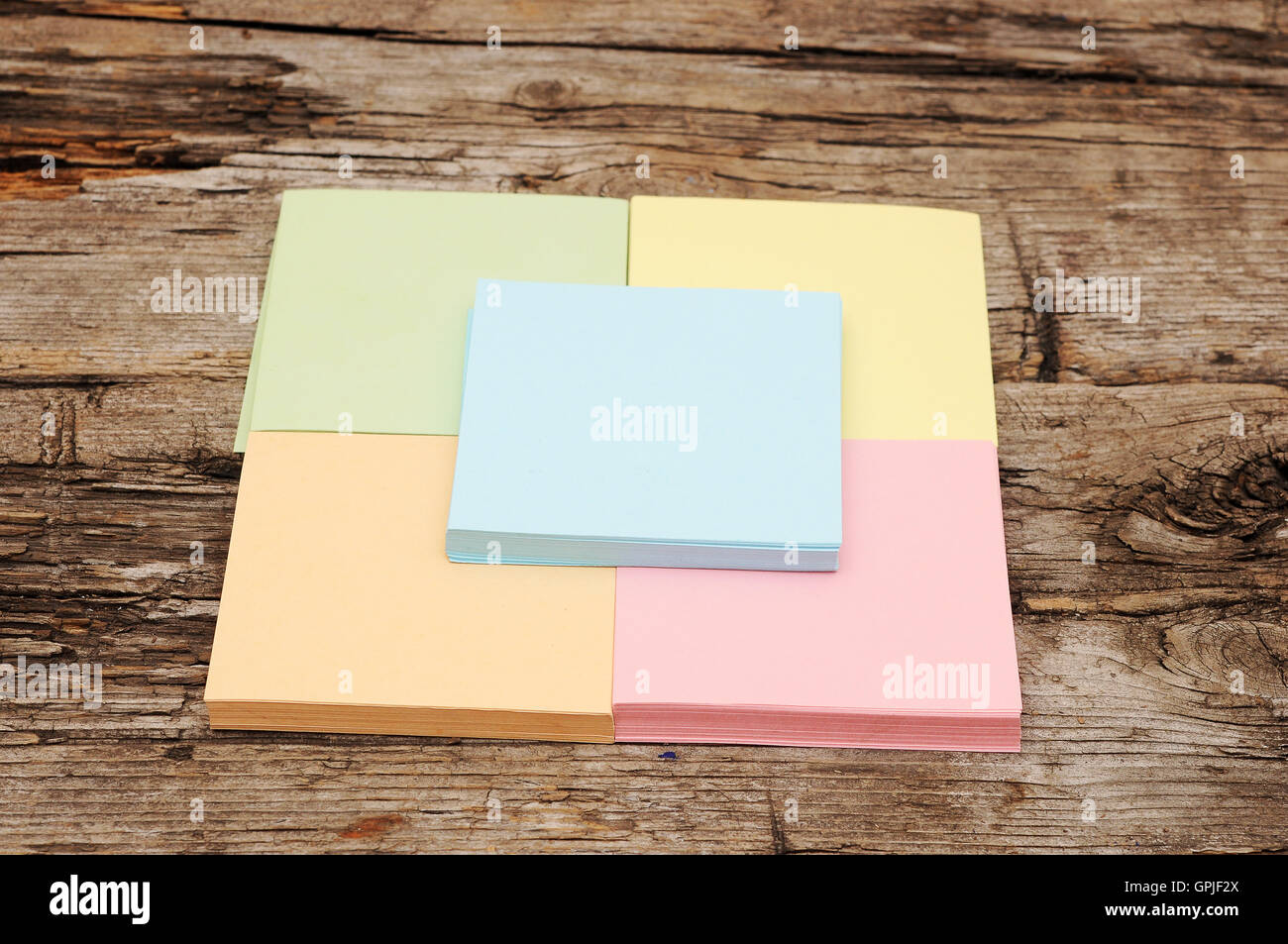 Stack of colorful sticky notes on wooden background Stock Photo - Alamy
