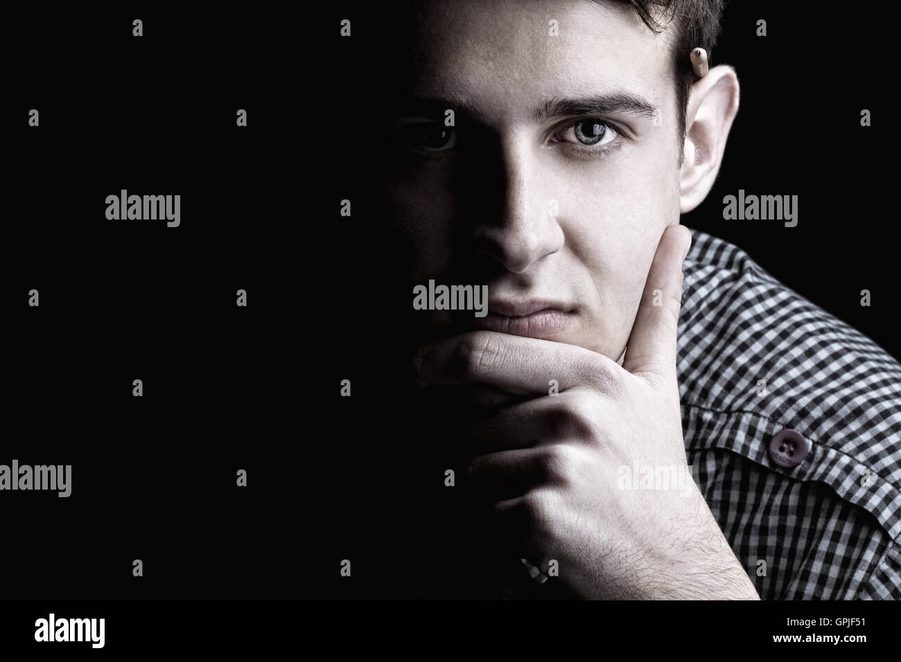 Portrait of young man thinking 2 Stock Photo - Alamy
