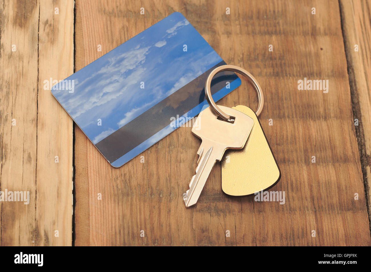 key with plastic card and reflection blue sky and clouds Stock Photo ...