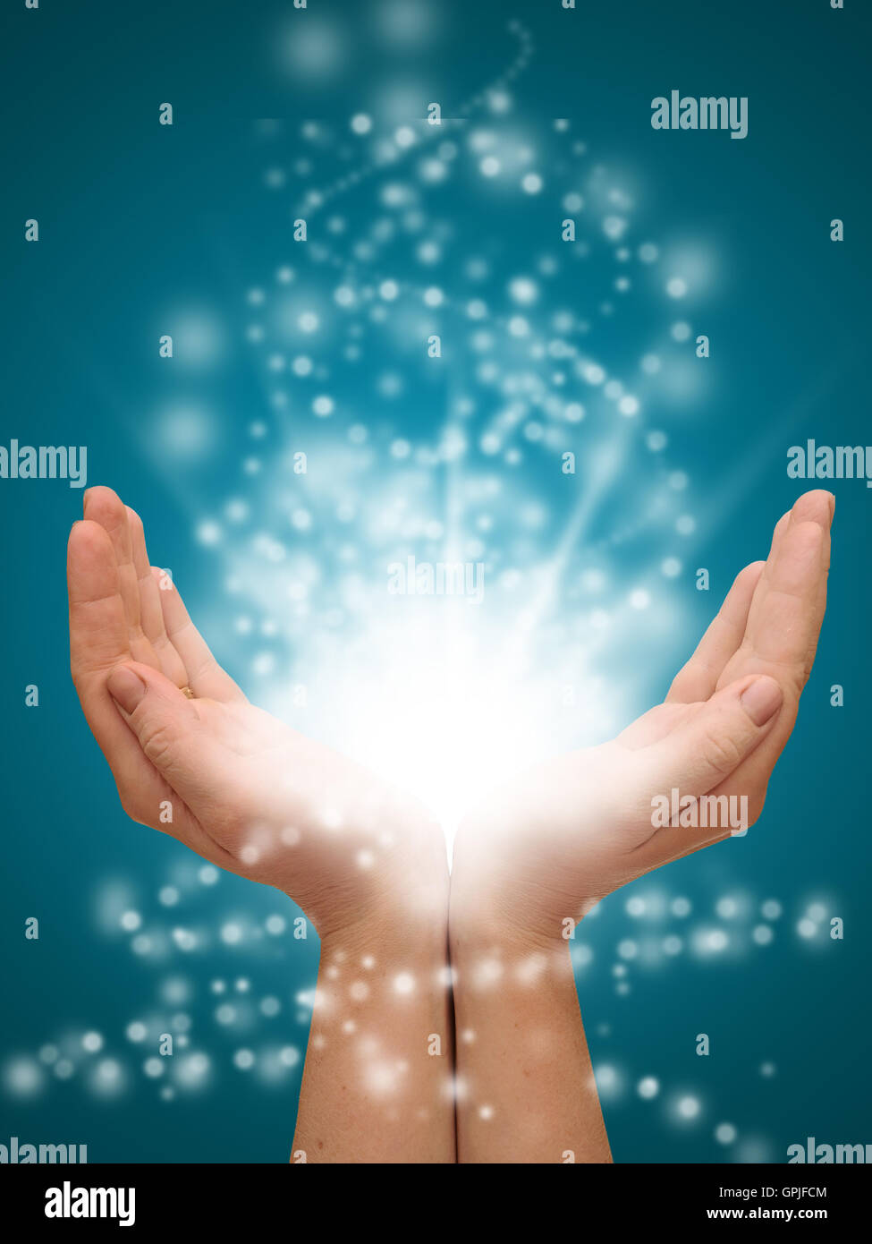 Holding hands open with glowing lights Stock Photo - Alamy