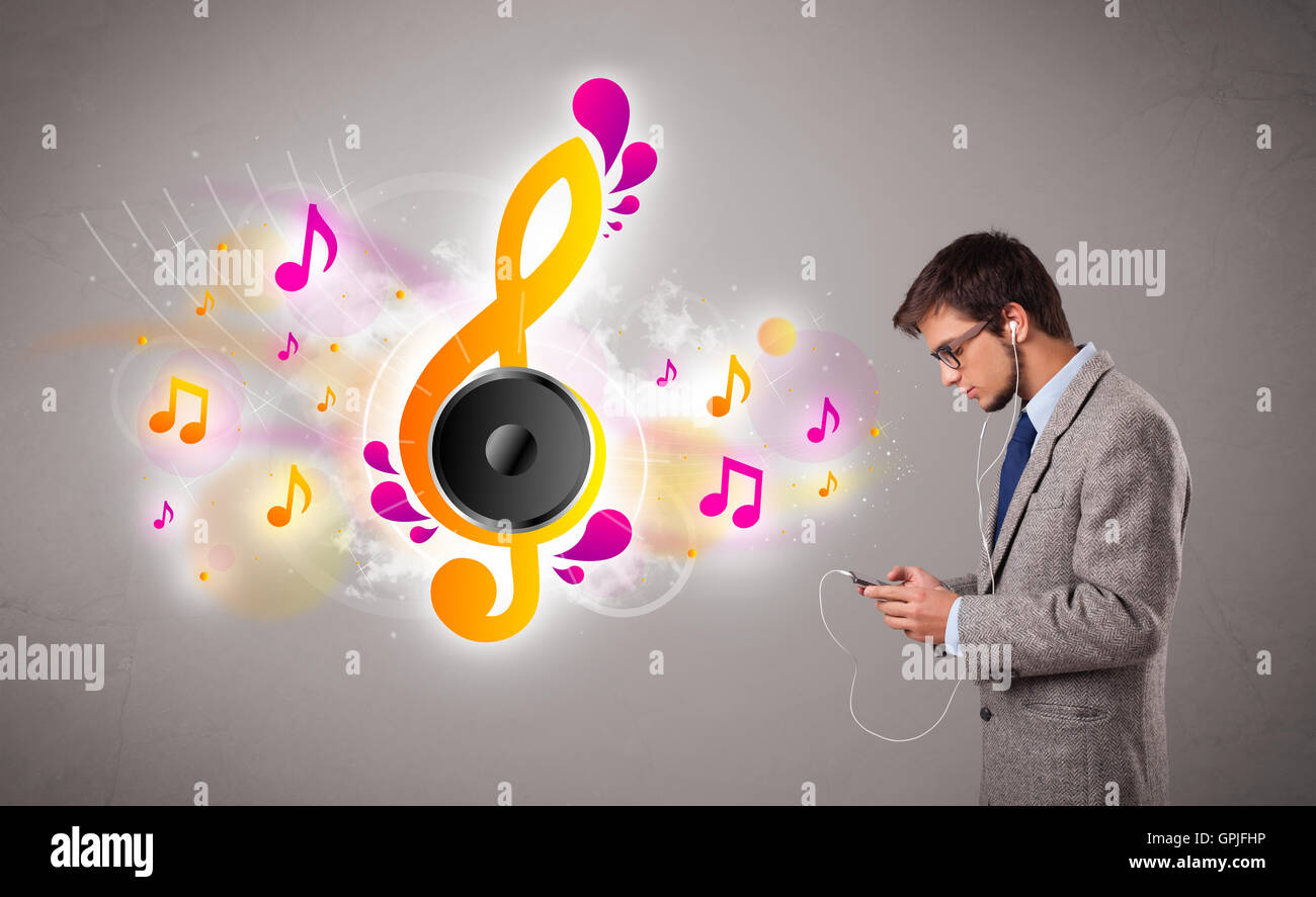 young man singing and listening to music with musical notes Stock Photo ...